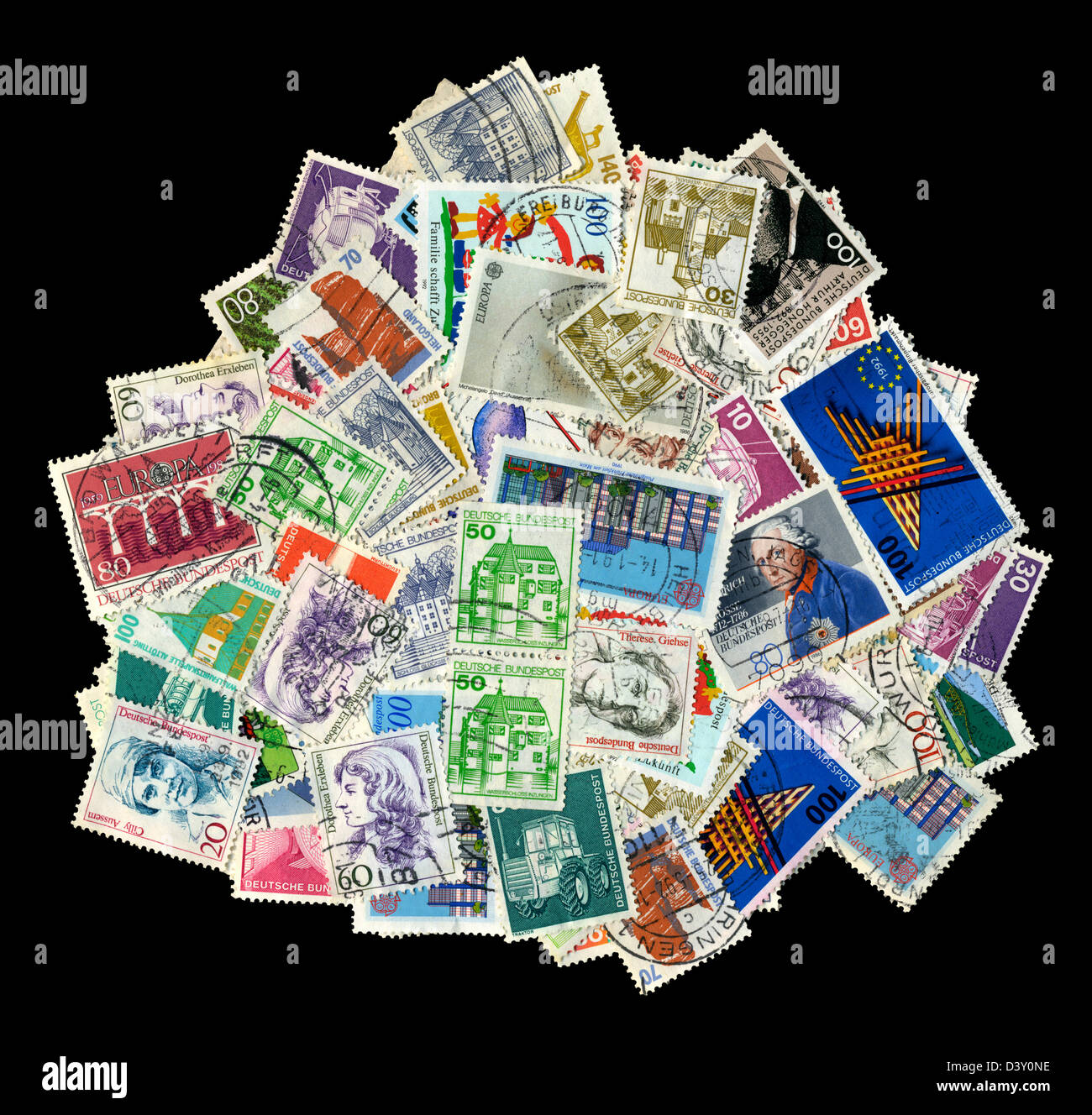 pile of old german postage stamps in black back Stock Photo - Alamy