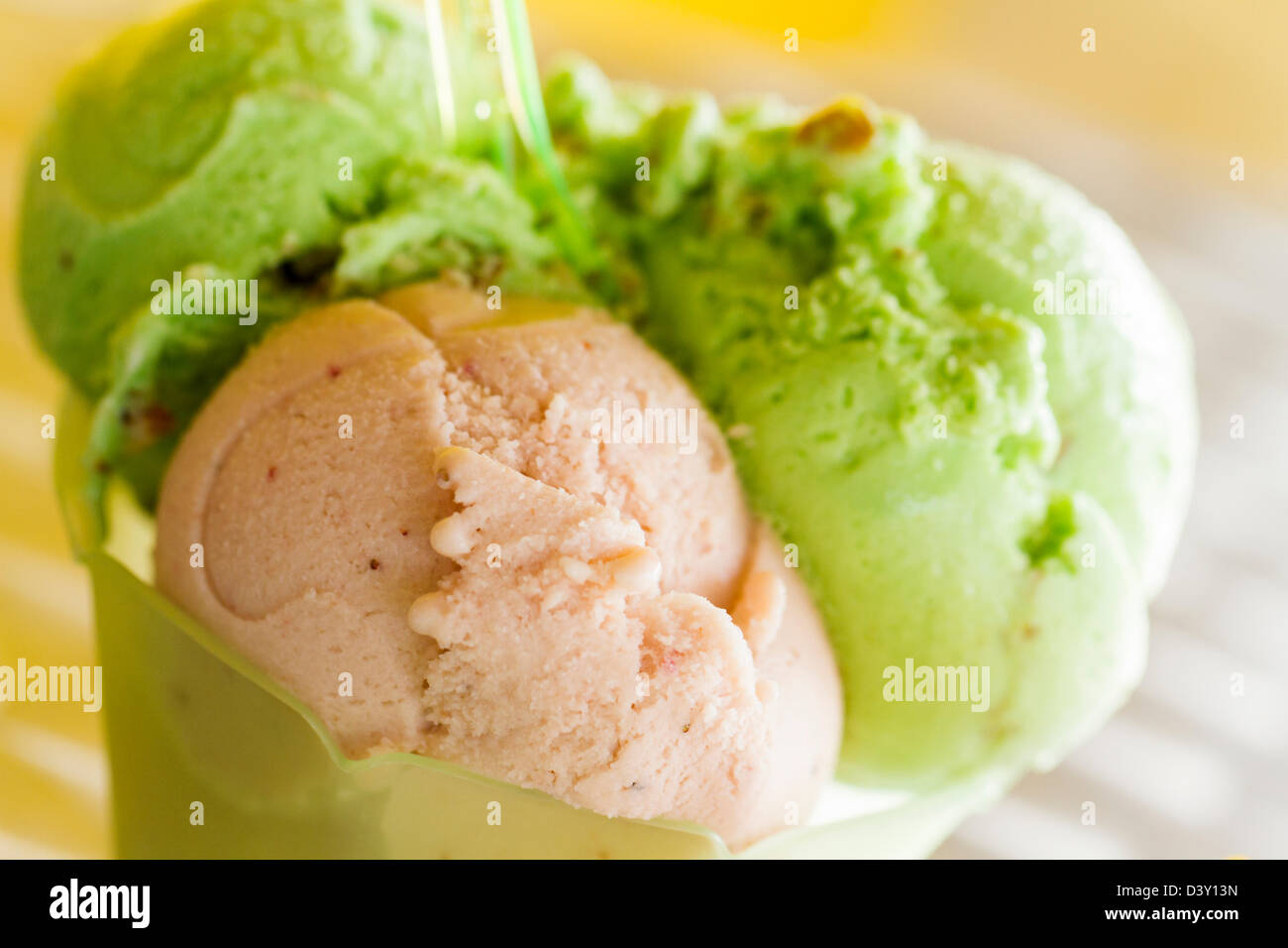 Green gelato in green plastic cup Stock Photo - Alamy