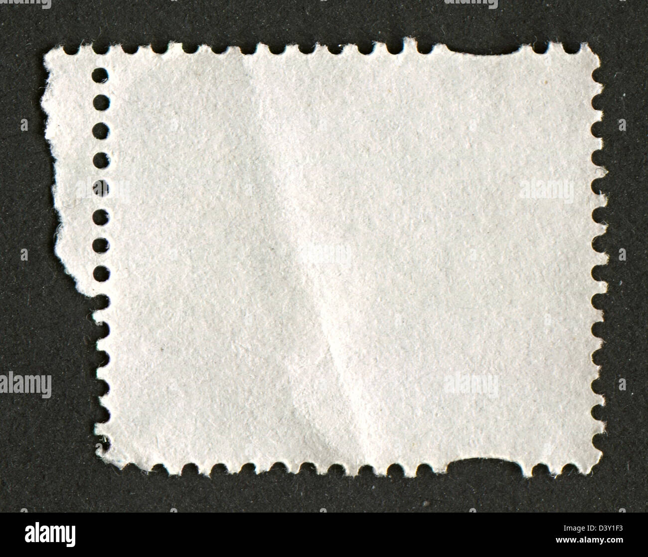 The reverse side of a postage stamp Stock Photo - Alamy