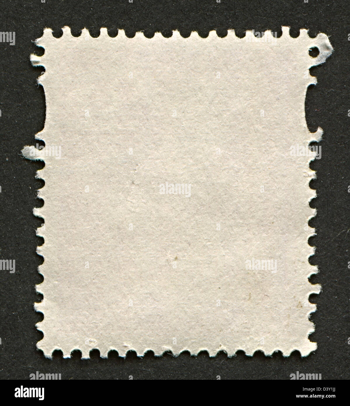 The reverse side of a postage stamp Stock Photo - Alamy