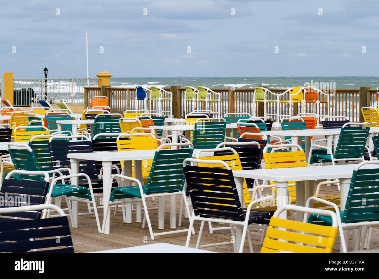 Empty patio with multi color chair Stock Photo - Alamy