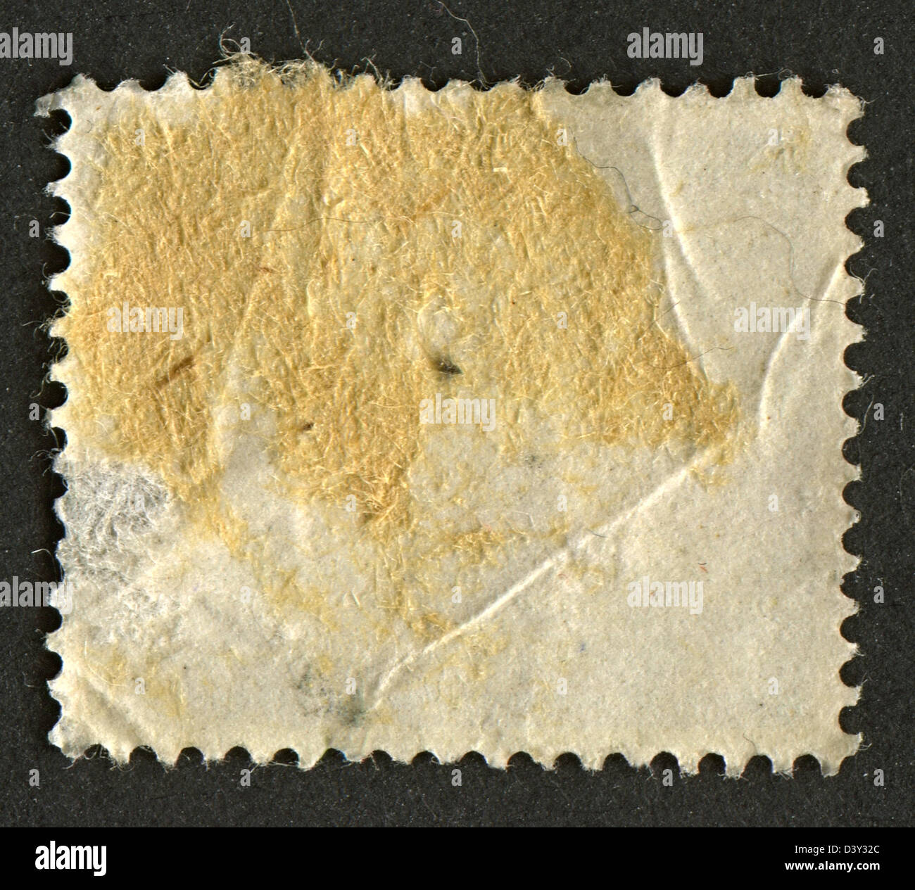 The reverse side of a postage stamp Stock Photo - Alamy
