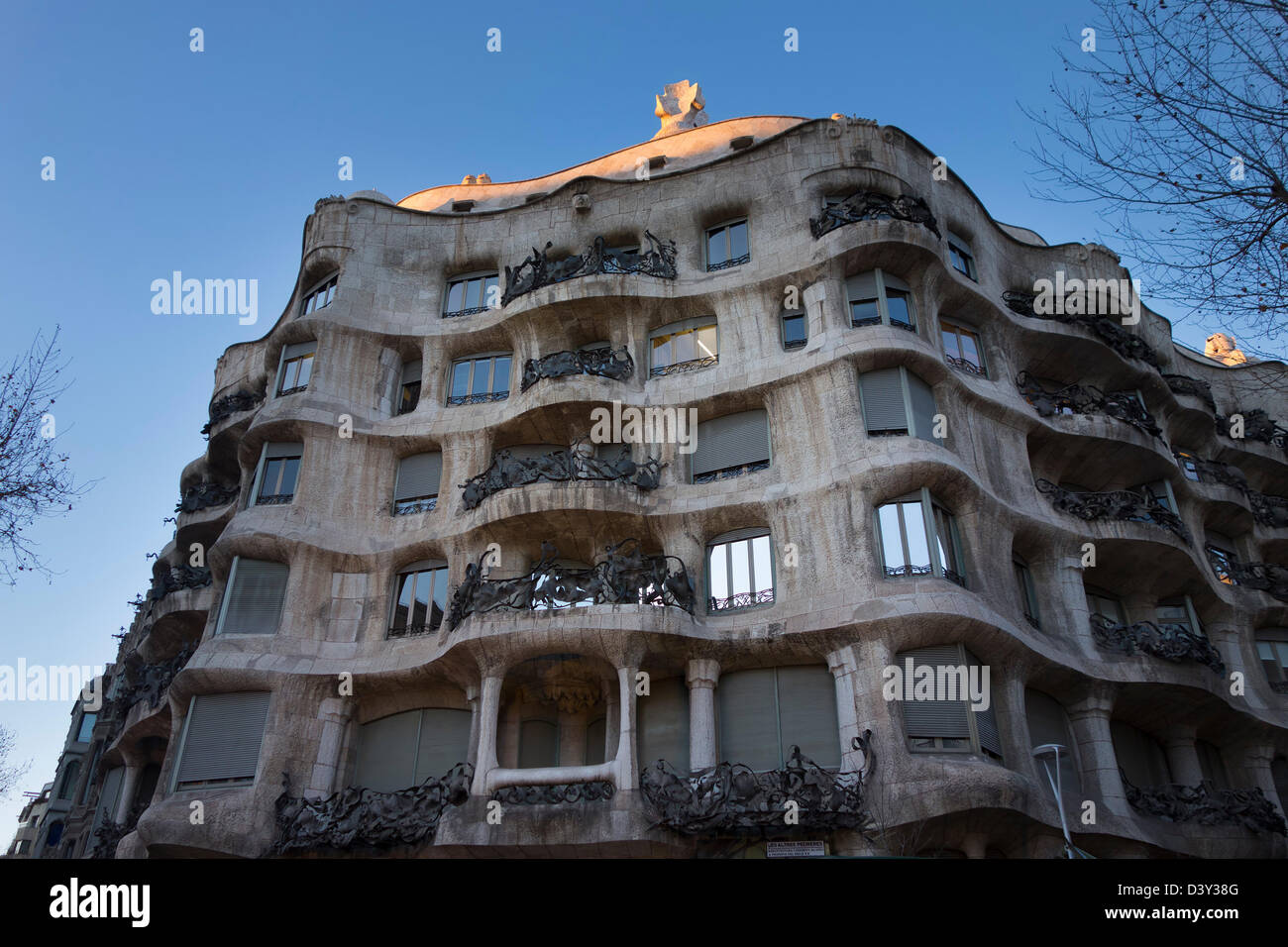Casa Milà or La Pedrera building designed by Antoni Gaudi at sunset ...