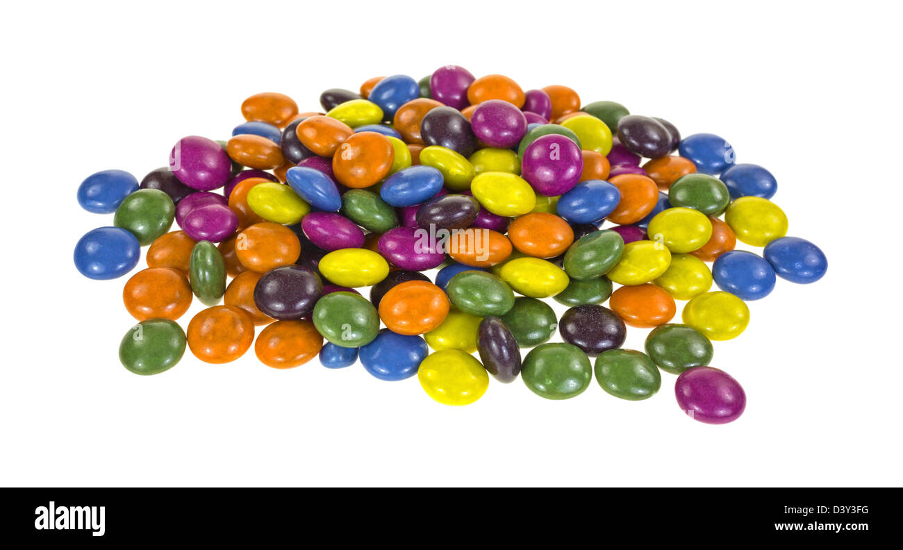 A group of small chocolate candies colorfully coated on a white ...