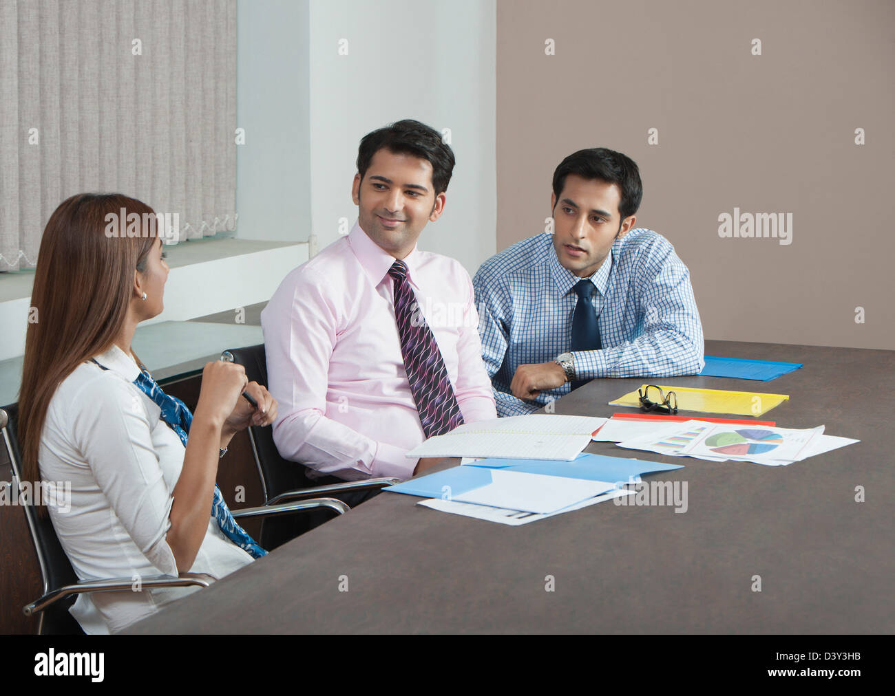 Business executives talking to each other Stock Photo - Alamy