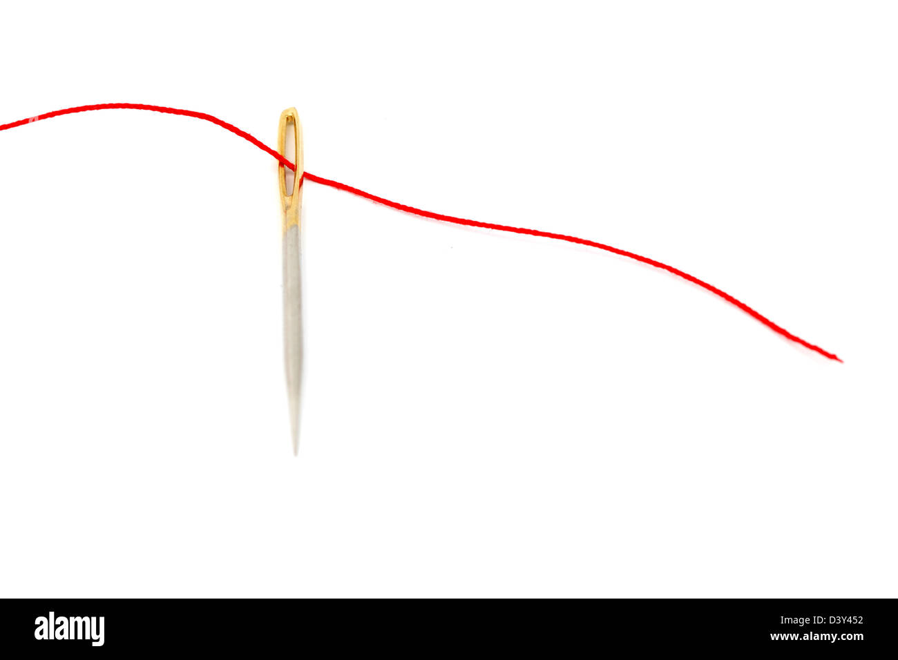 Thread and needle close-up Stock Photo - Alamy