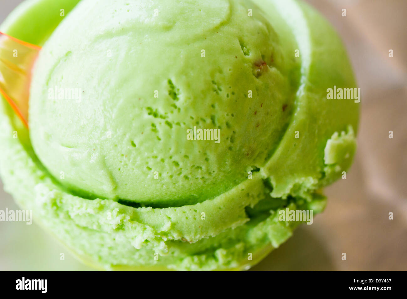 Green gelato in green plastic cup Stock Photo - Alamy