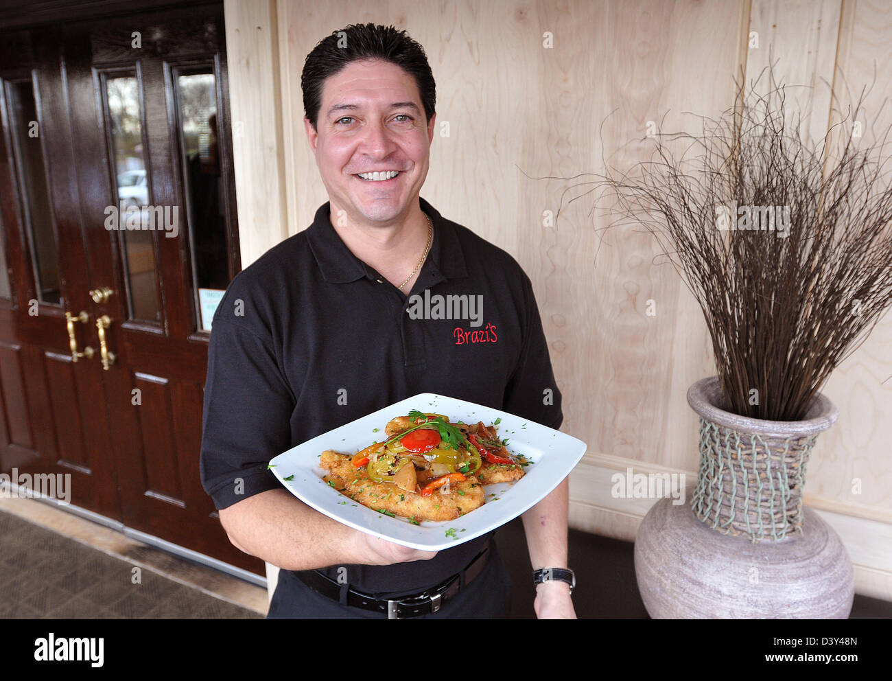 Chicken Scarpiello with restaurant owner Stock Photo - Alamy