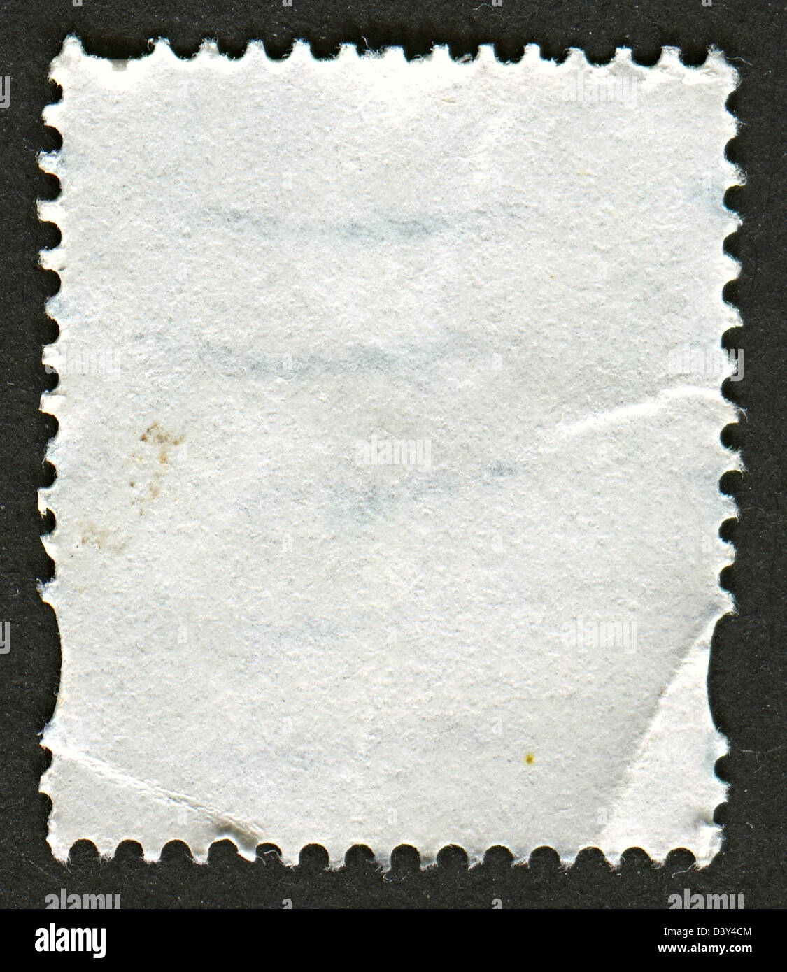 The reverse side of a postage stamp Stock Photo - Alamy