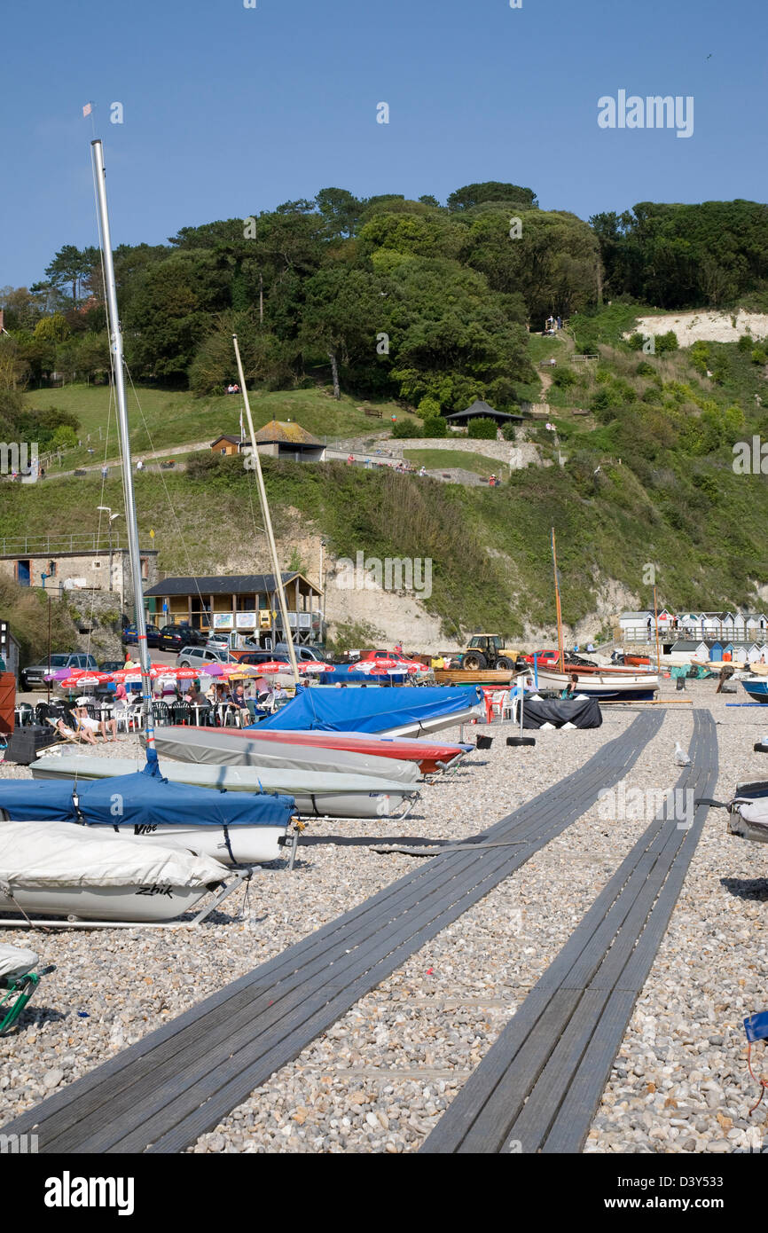 Beer beach with sailing club boats and wooden walkway, Devon, England ...