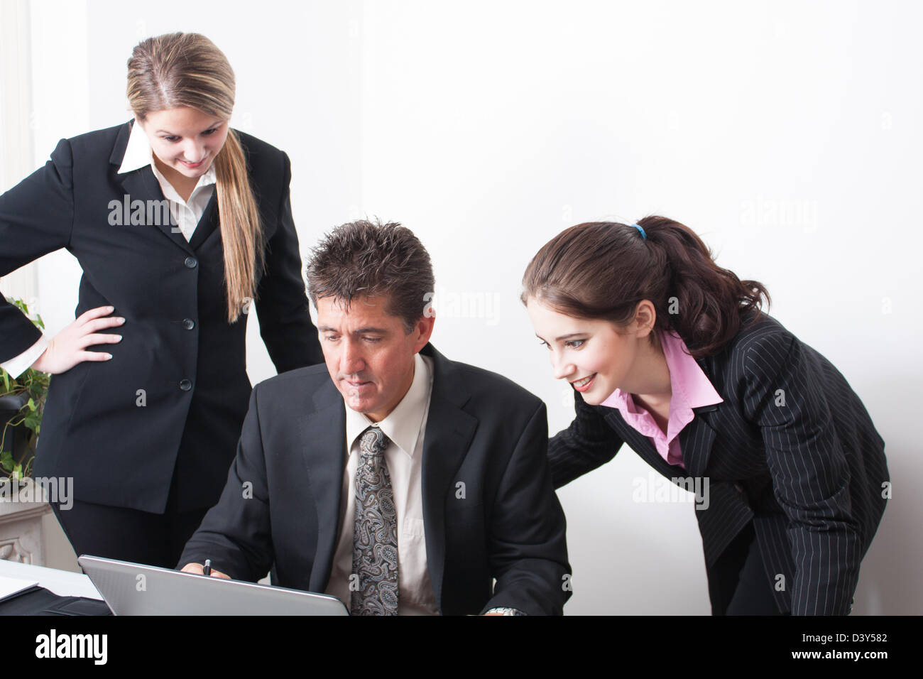 Business people in discussion around hi-res stock photography and ...