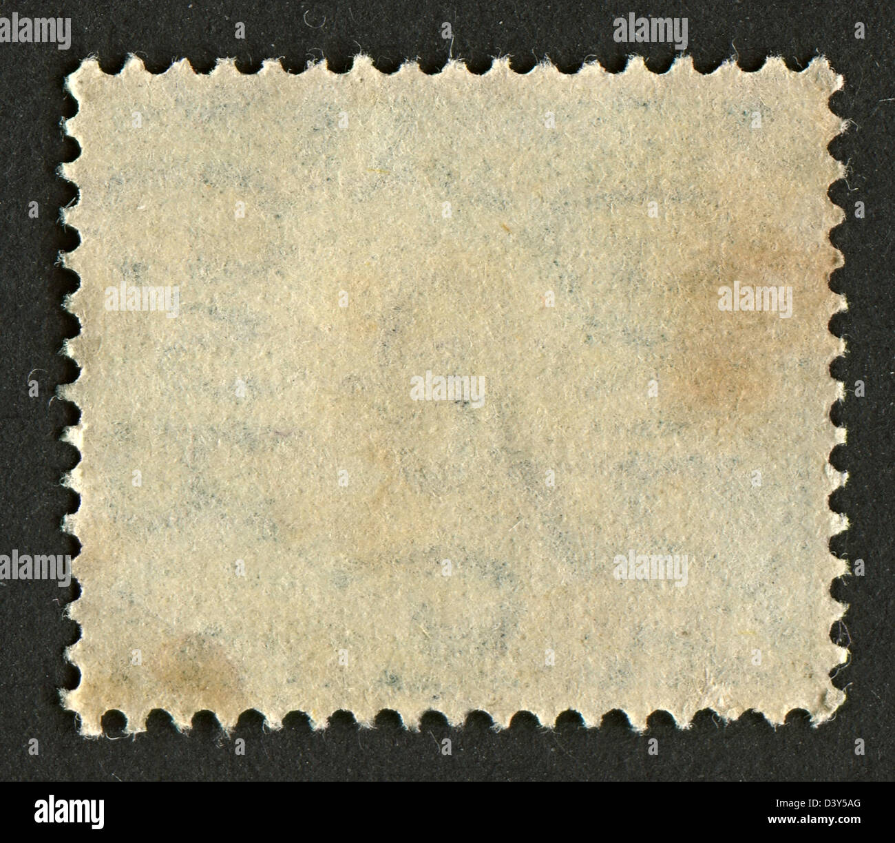 The reverse side of a postage stamp Stock Photo - Alamy