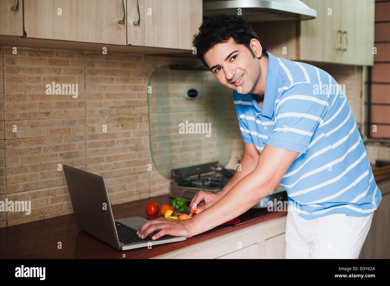 Man cooking in the kitchen Stock Photo - Alamy