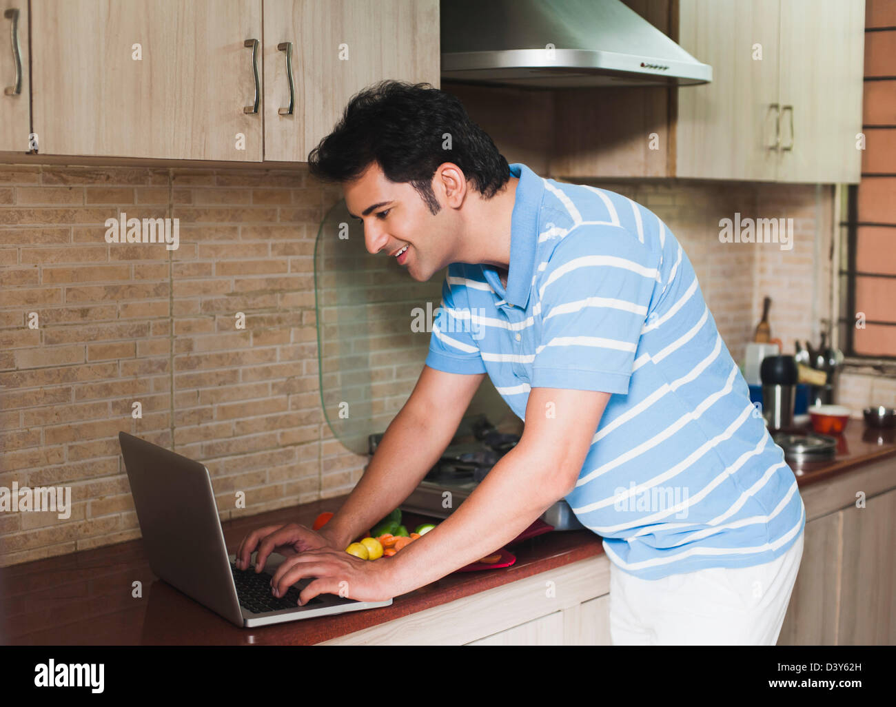 Man cooking in the kitchen Stock Photo - Alamy