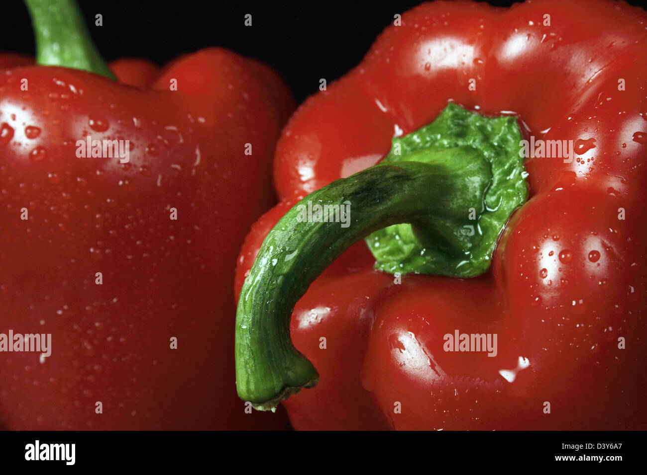 Two washed red peppers Stock Photo - Alamy