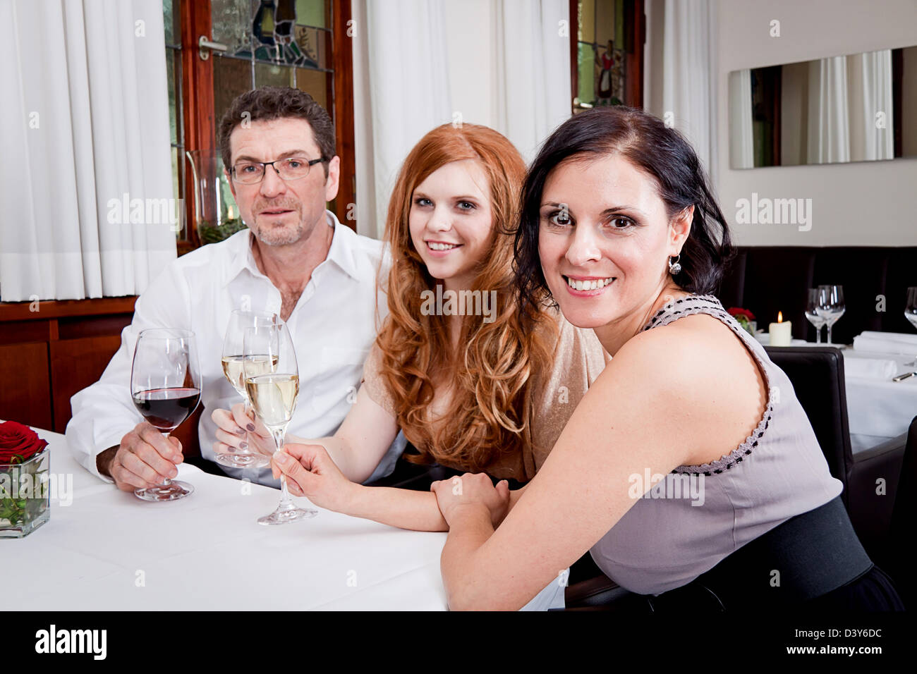 smiling happy people in restaurant drinking talking having fun Stock ...