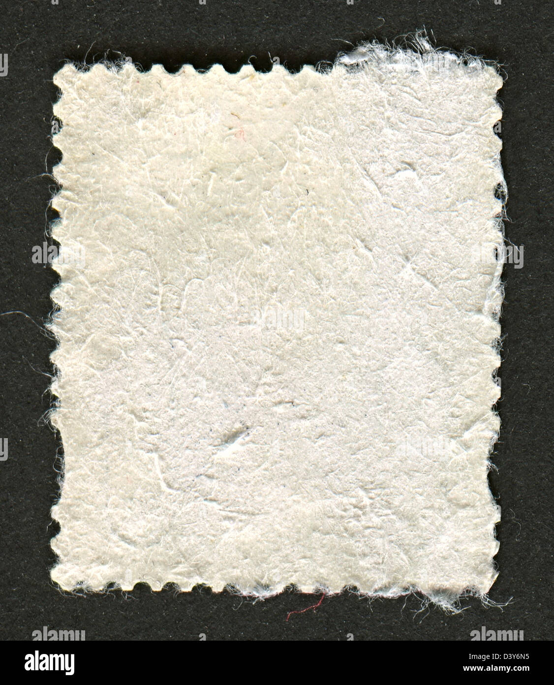 The reverse side of a postage stamp Stock Photo - Alamy