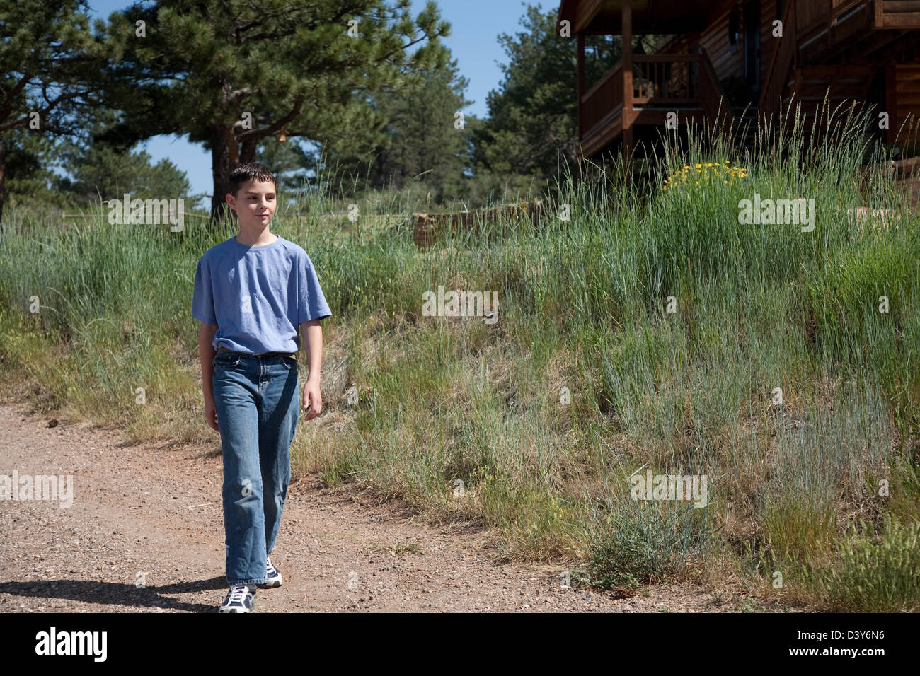 Young boy doing chores on ranch or farm Stock Photo - Alamy