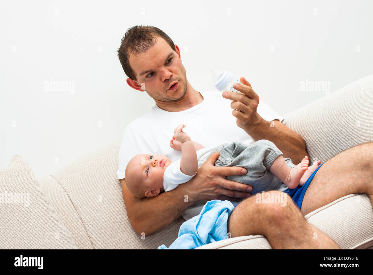 Man feeding a baby hi-res stock photography and images - Alamy