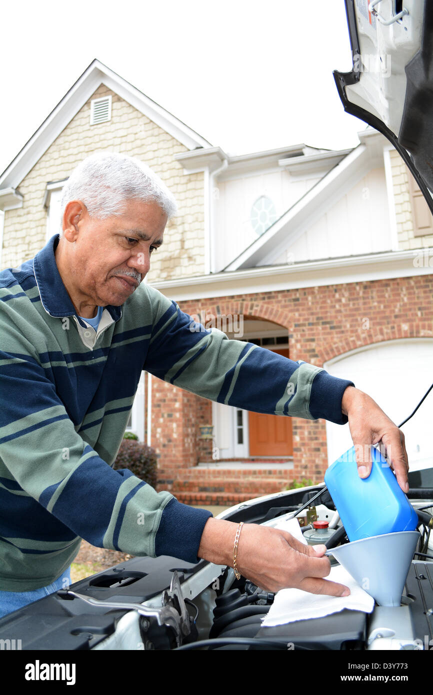 Mechanic working on a car in his driveway Stock Photo - Alamy