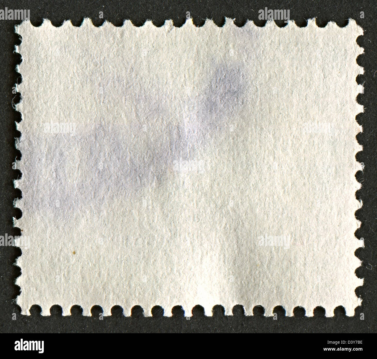 The reverse side of a postage stamp Stock Photo - Alamy