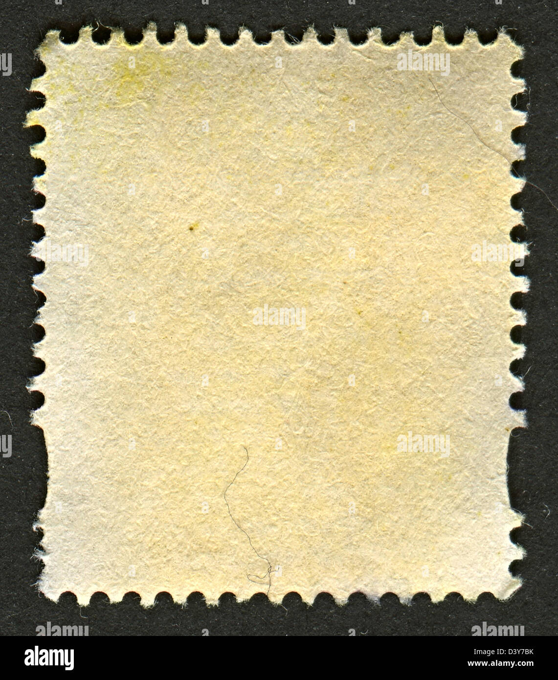 The reverse side of a postage stamp Stock Photo - Alamy