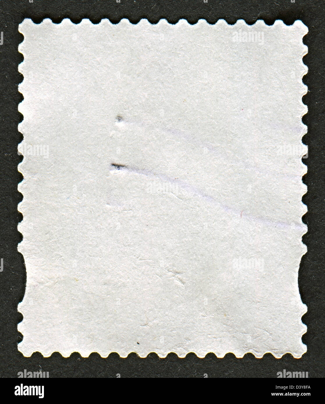 The reverse side of a postage stamp Stock Photo - Alamy