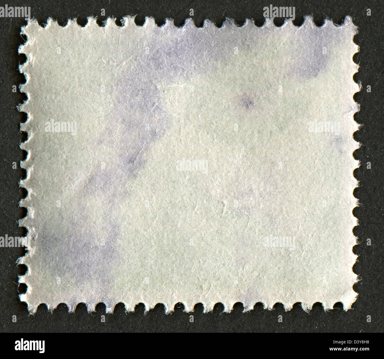 The reverse side of a postage stamp Stock Photo - Alamy
