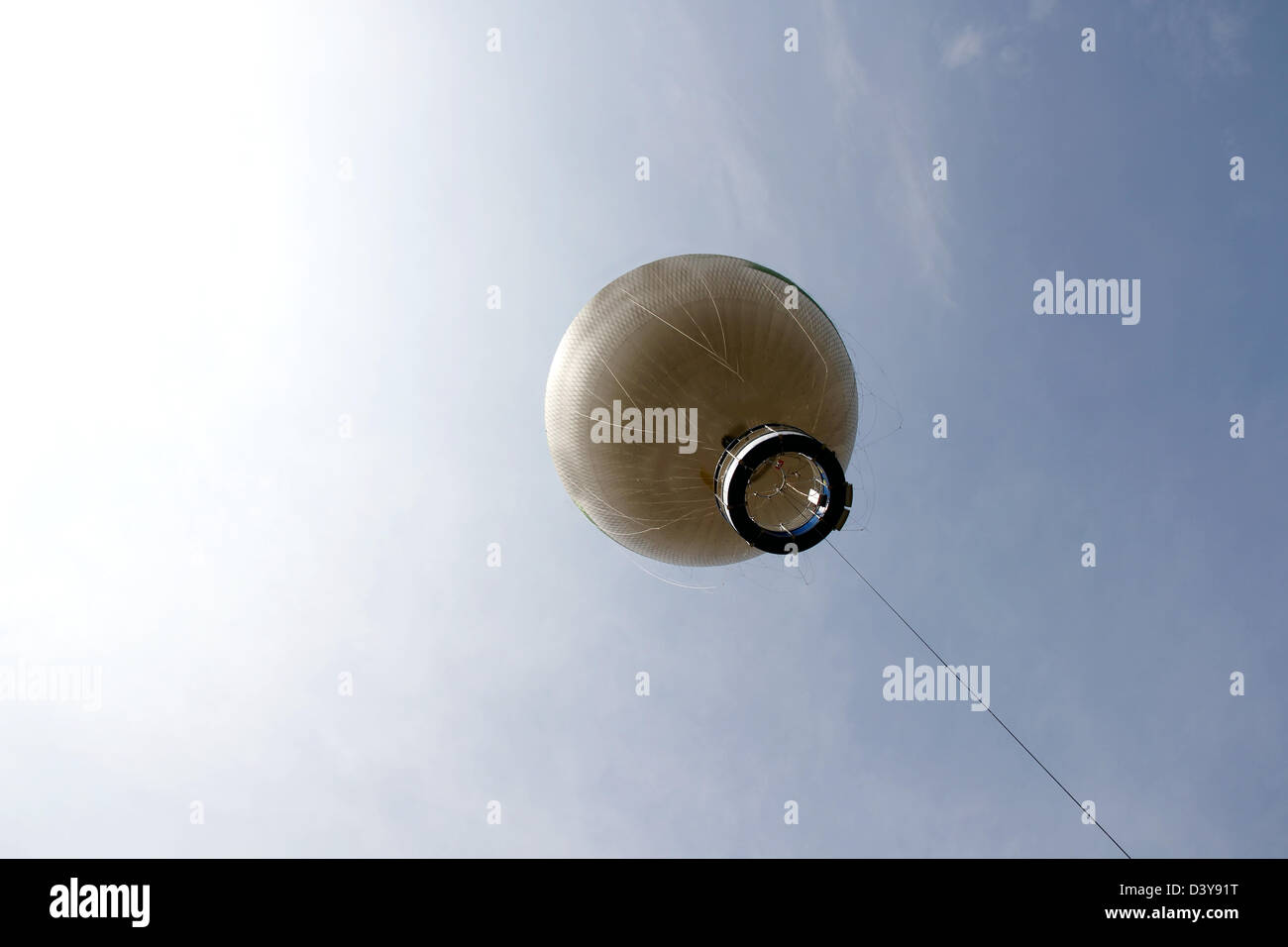 A Captive Ballon rising towards the sky Stock Photo - Alamy