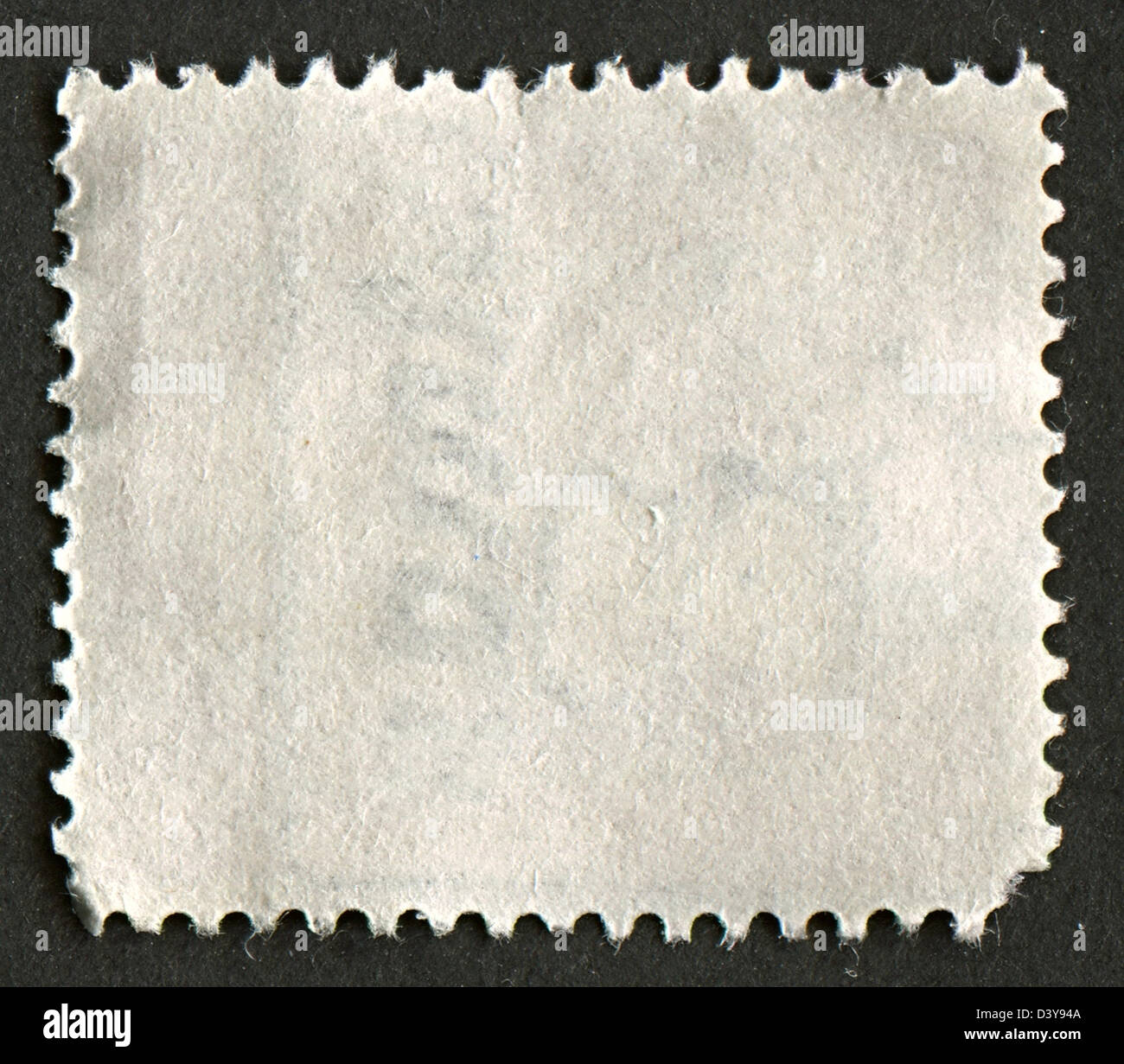 The reverse side of a postage stamp Stock Photo - Alamy