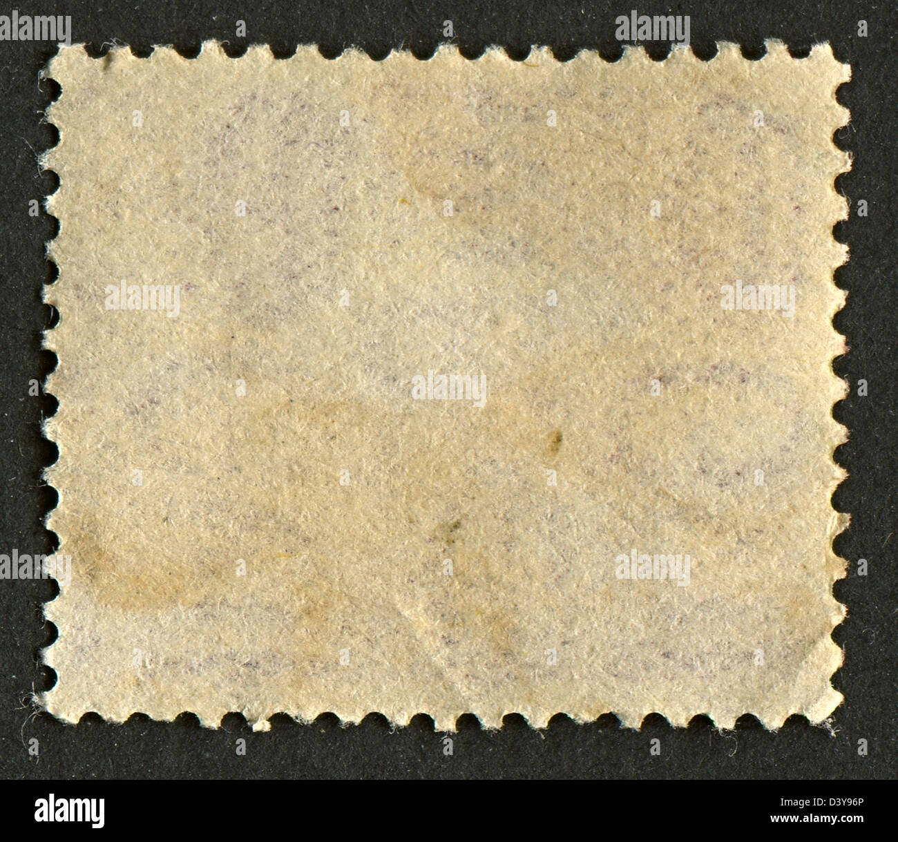 The reverse side of a postage stamp Stock Photo - Alamy