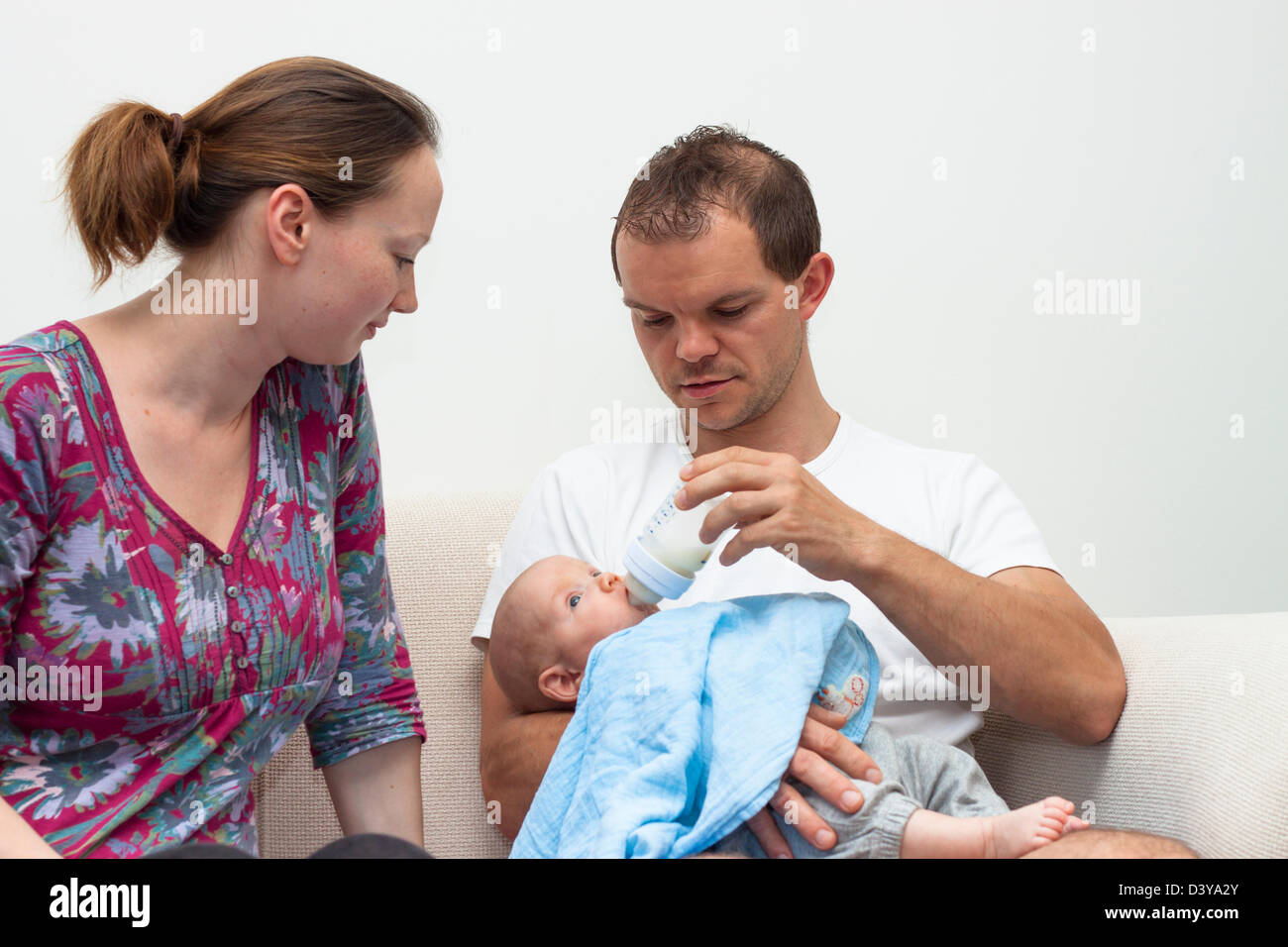 Father feeding new born baby hi-res stock photography and images - Alamy