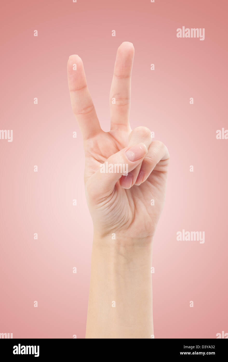 Hand with two fingers up in the peace or victory symbol. Also the sign ...