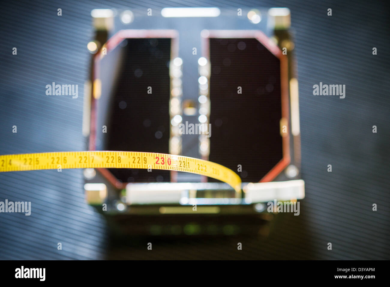 A measuring tape converted into an antenna sticks out of an engineering ...