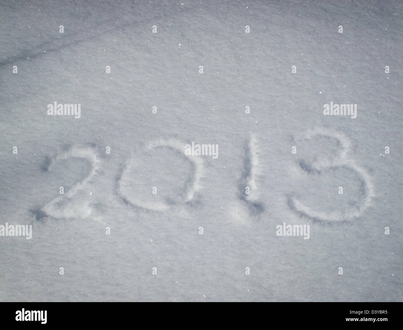 Sign of year 2013 in snow Stock Photo - Alamy