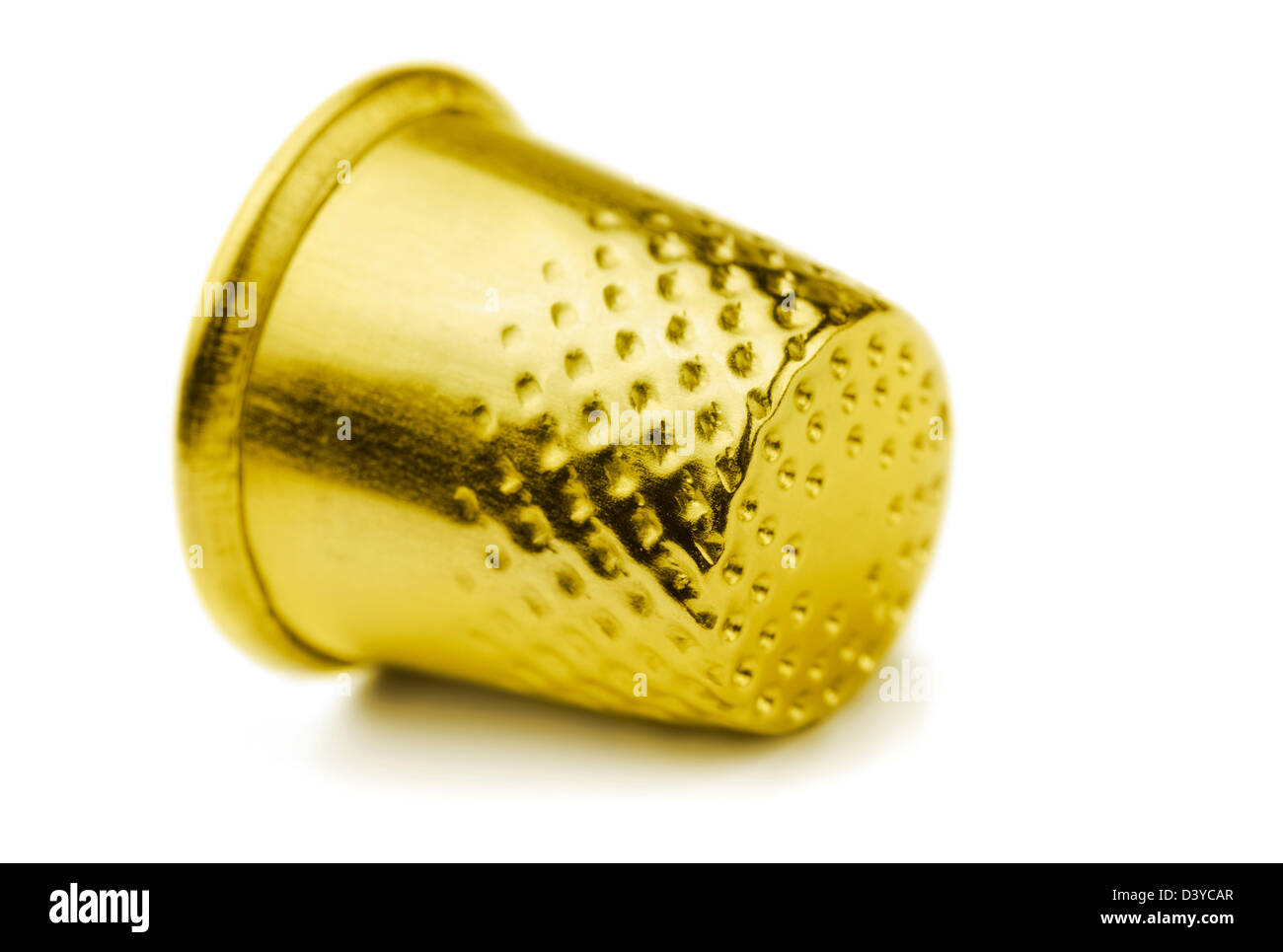 Golden sewing thimble isolated on white Stock Photo - Alamy