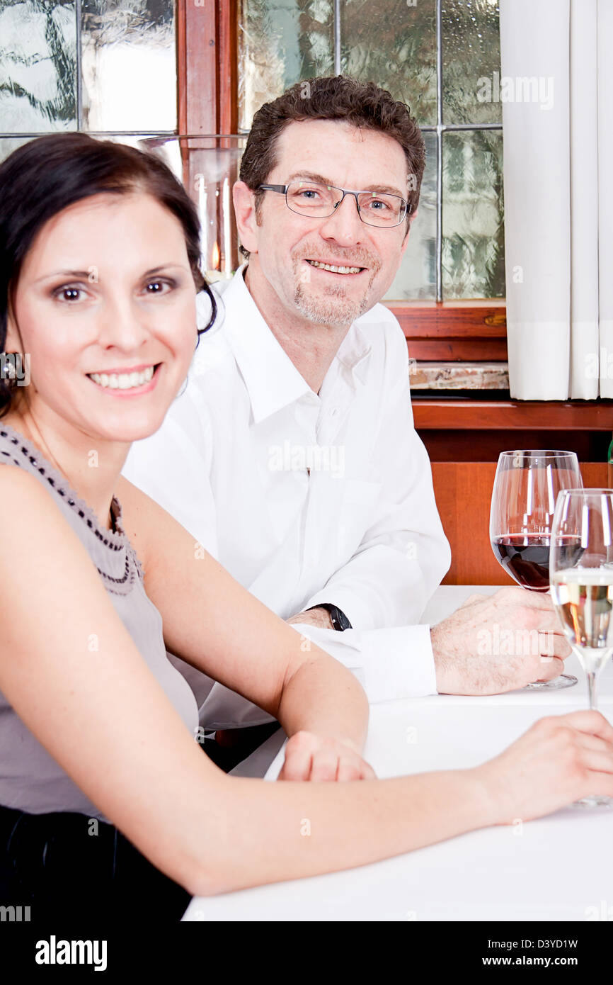 smiling happy people in restaurant drinking talking having fun Stock ...