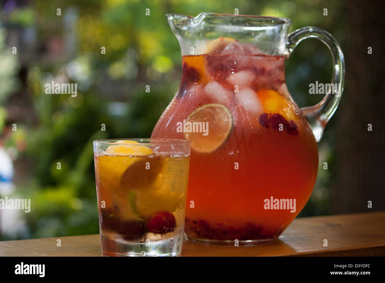 Large glass pitcher of raspberry lemonade with a glass of lemonade ...