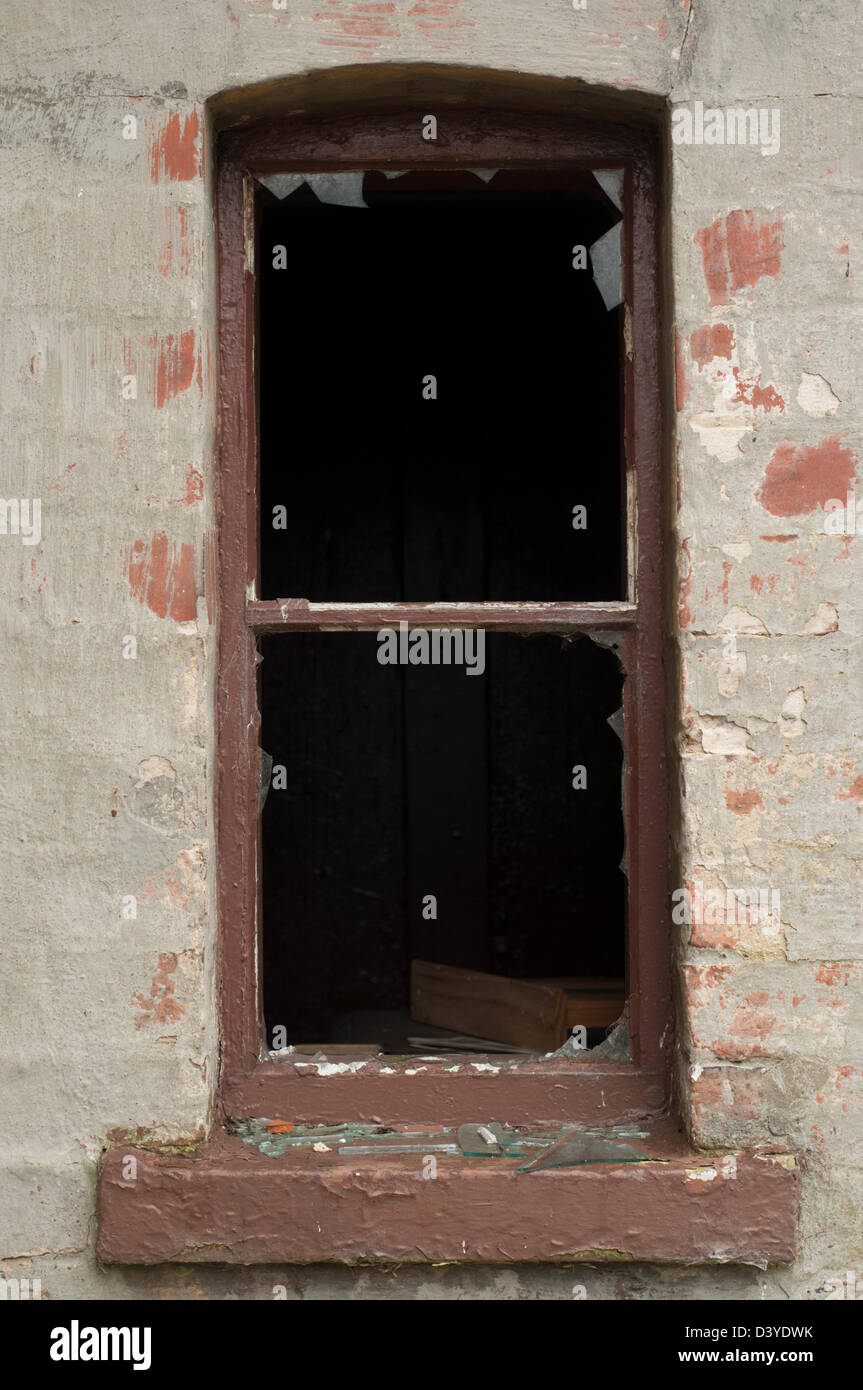 Broken window of derelict abandoned house Stock Photo - Alamy