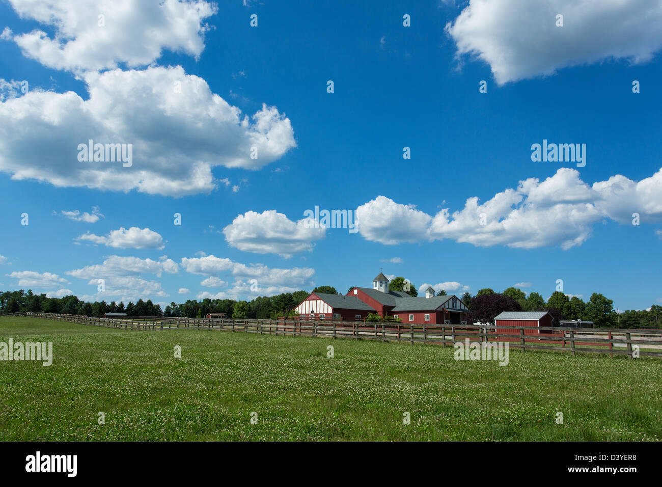Farm house with a big grass field Stock Photo - Alamy