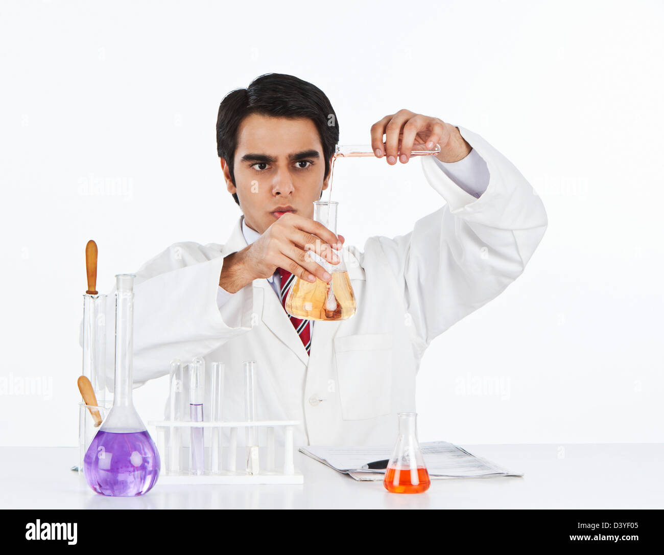 Male scientist doing scientific experiment in a laboratory Stock Photo ...