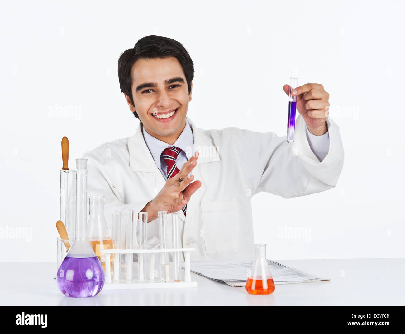 Male scientist doing scientific experiment in a laboratory Stock Photo ...