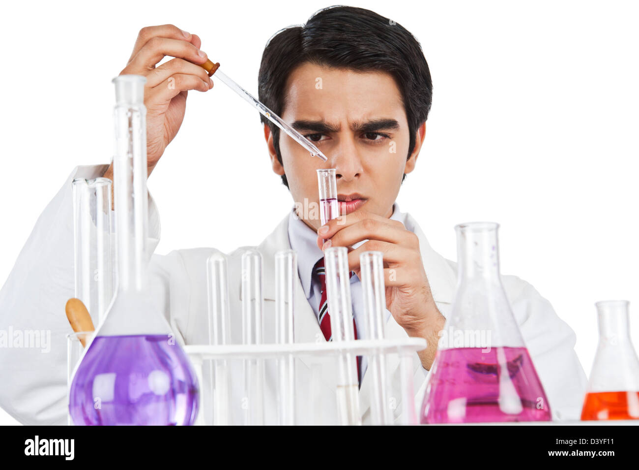 Male scientist doing scientific experiment in a laboratory Stock Photo ...