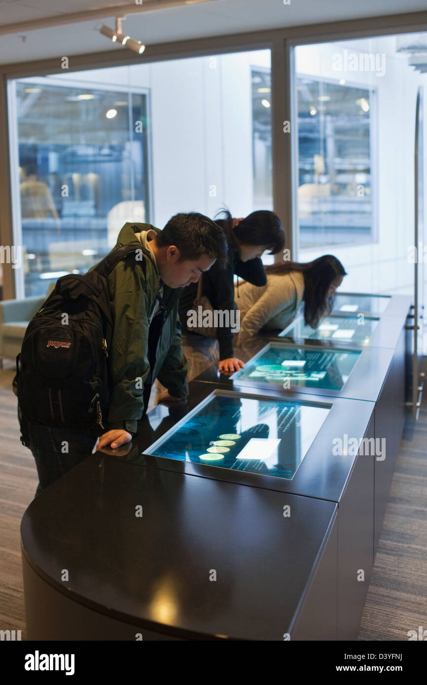 Tourists viewing coin history exhibits at the Royal Australian Mint ...