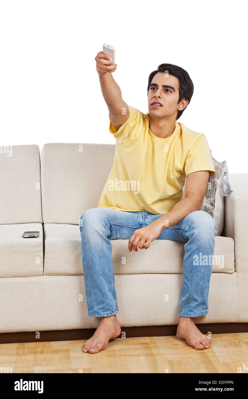 Man operating a remote control Stock Photo - Alamy