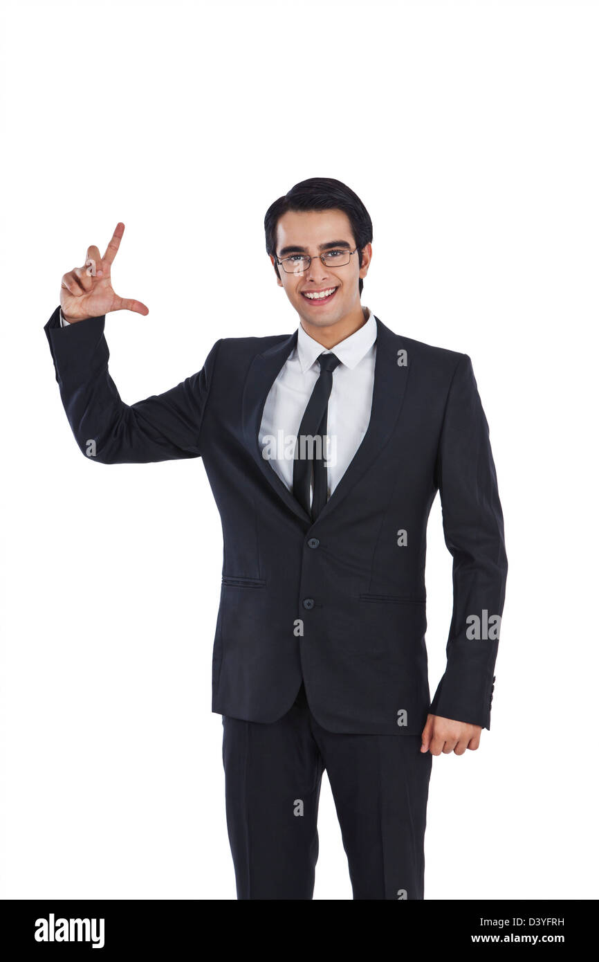Portrait of a businessman gesturing Stock Photo - Alamy