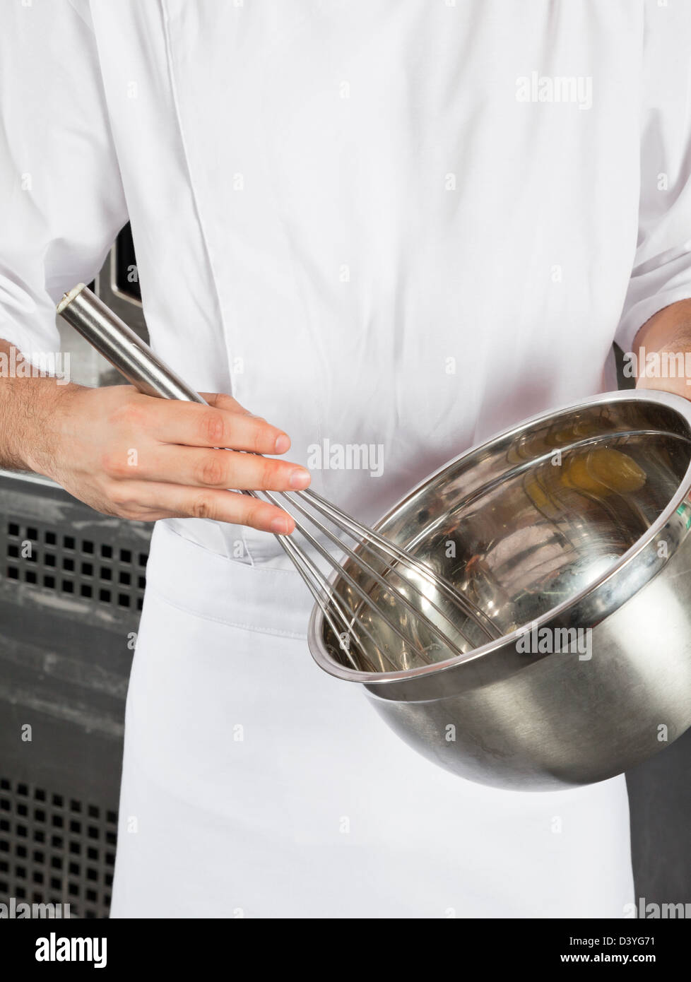 Chef With Wire Wisk And Mixing Bowl Stock Photo - Alamy