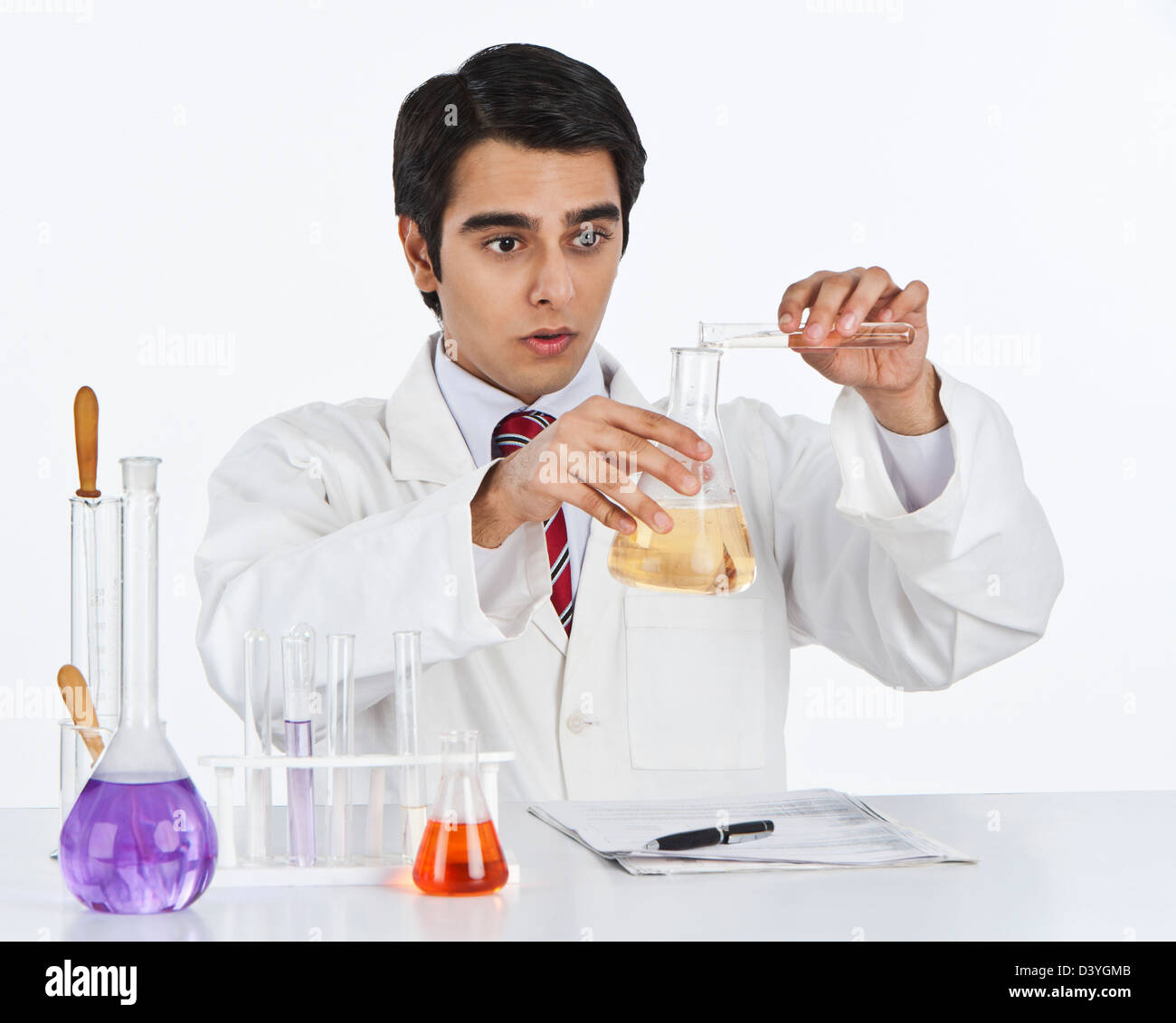 Male scientist doing scientific experiment in a laboratory Stock Photo ...