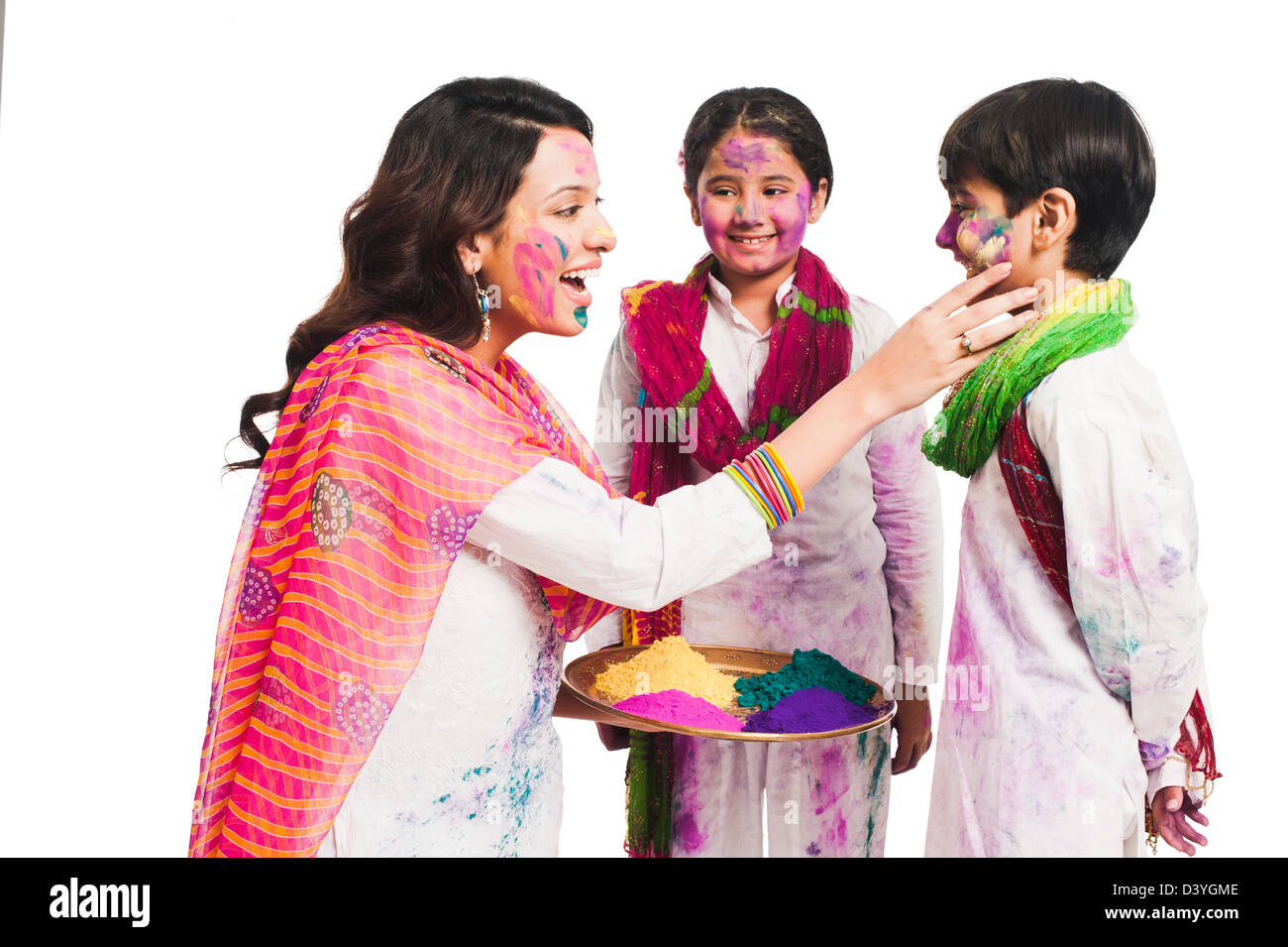 Woman celebrating Holi festival with her children Stock Photo - Alamy