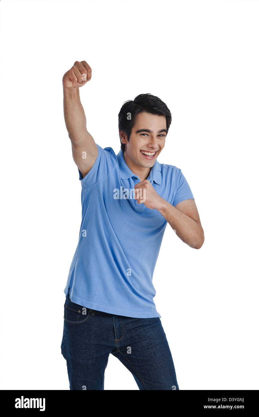 Man celebrating his success and smiling Stock Photo - Alamy